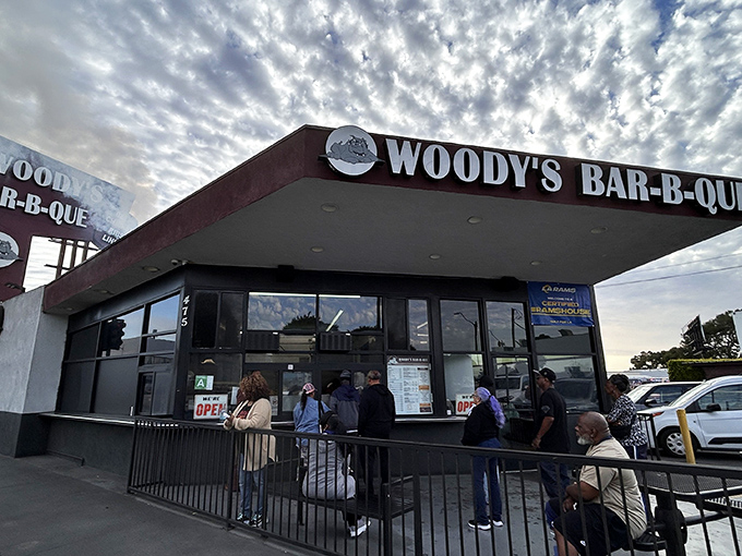 The iconic Woody's Bar-B-Que storefront stands like a beacon of smoky promise on Crenshaw Boulevard, drawing BBQ pilgrims from across Los Angeles.