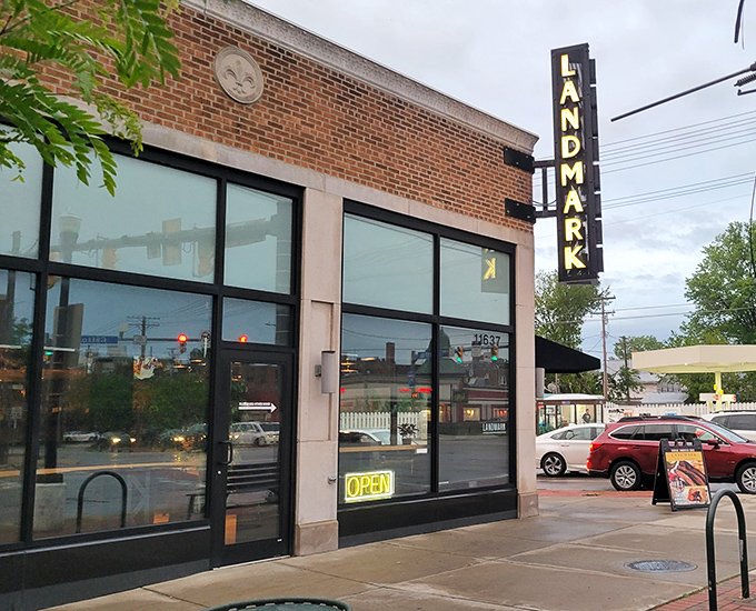 The unassuming brick exterior of Landmark Smokehouse belies the flavor explosion waiting inside. That vertical sign is basically a beacon for BBQ pilgrims.