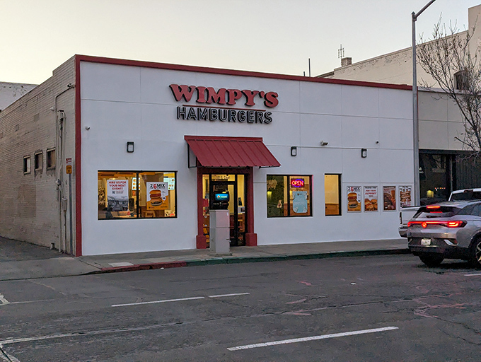 The unassuming white exterior with bold red signage promises what every great food discovery should: spectacular flavor without the fanfare.