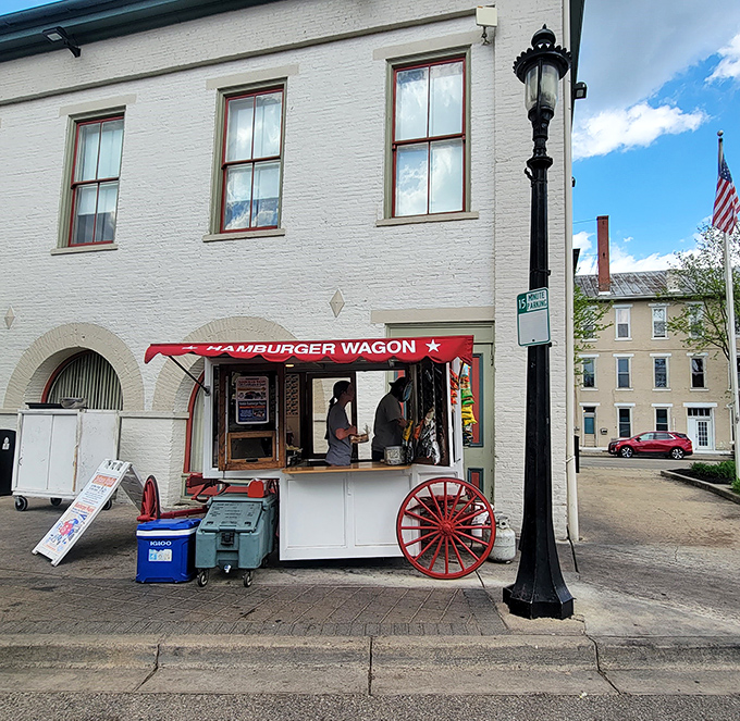 The iconic red awning beckons like a culinary lighthouse on Miamisburg's brick-paved streets. Simple, unassuming, and hiding a century of burger perfection.