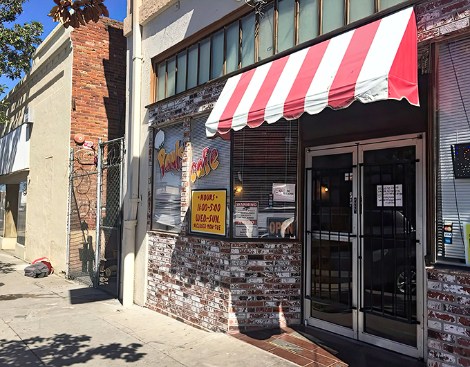 The unassuming exterior of Chef Paul's Cafe proves once again that culinary treasures often hide behind the simplest facades. That red and white awning? A beacon for those in the know.