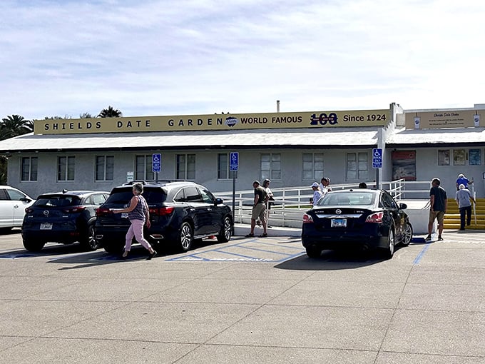 The unassuming exterior of Shields Date Garden stands like a time capsule in the desert, promising sweet treasures within its modest walls.