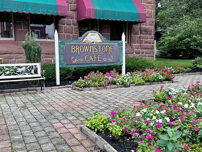 That charming brownstone exterior whispers "comfort food sanctuary" louder than any flashy billboard ever could.