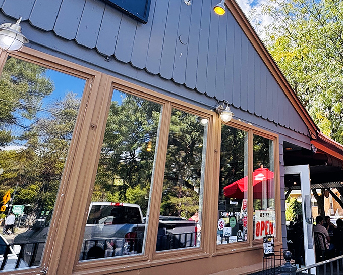 The blue exterior of The Park Caf&eacute; stands like a humble guardian of breakfast dreams, promising culinary magic within its unassuming walls.