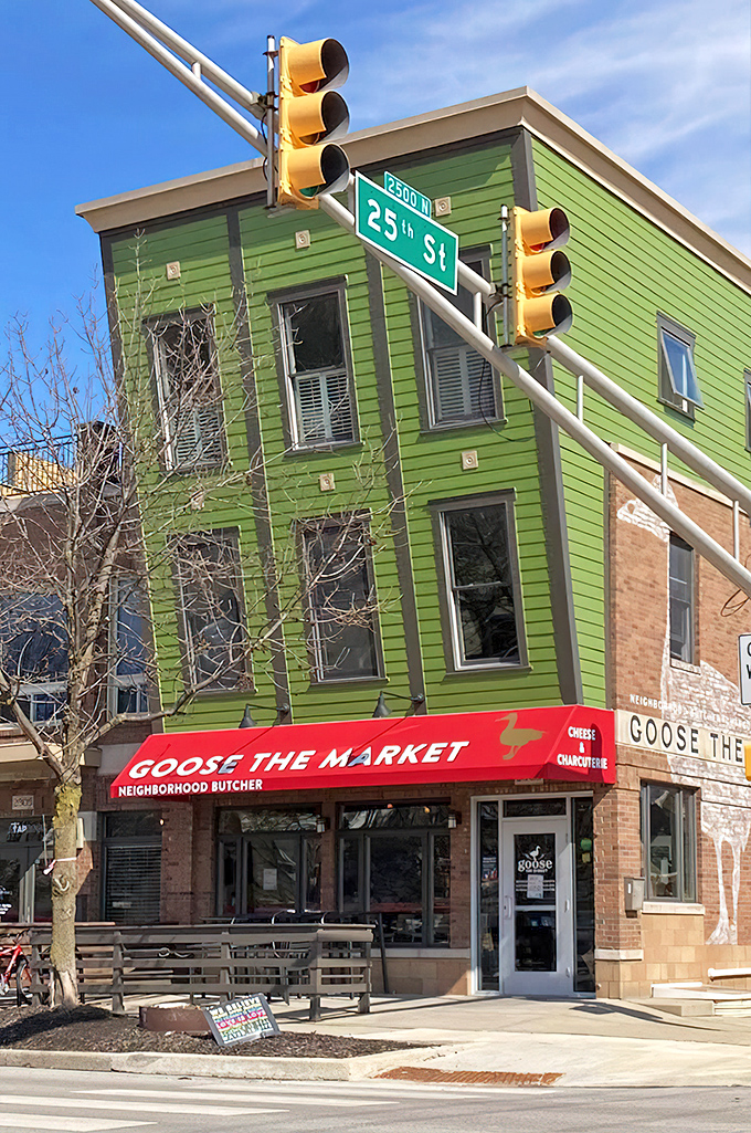 The unmistakable green building with its bold red awning stands like a culinary lighthouse at the corner of 25th Street, beckoning sandwich enthusiasts from miles around.