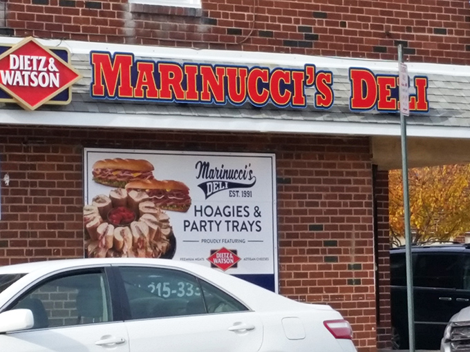 Marinucci's bold signage stands as a beacon of hope for the hoagie-hungry masses, promising Italian deli magic in a brick-faced sanctuary.