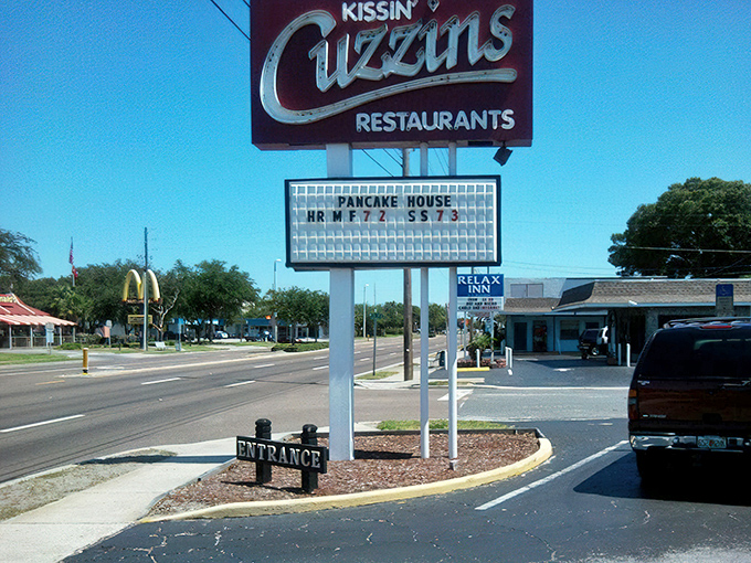The iconic Kissin' Cuzzins sign stands proudly on 34th Street, a beacon for breakfast enthusiasts and comfort food pilgrims in St. Petersburg.