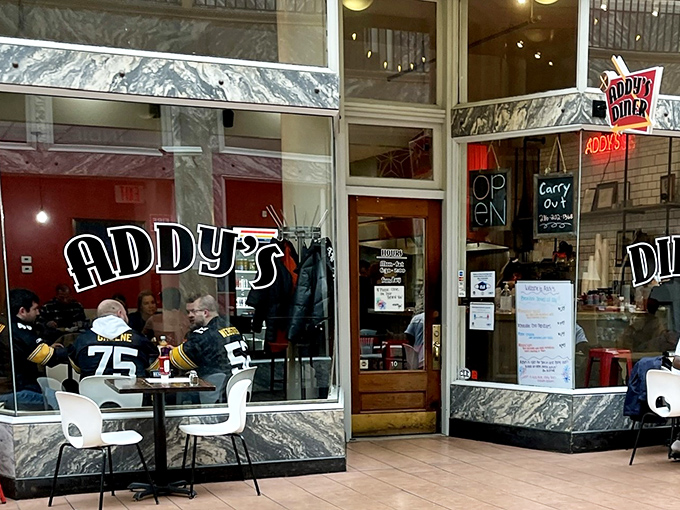 Addy's classic storefront beckons with marble accents and neon signage&mdash;like a time portal to when breakfast was an art form, not just a meal.