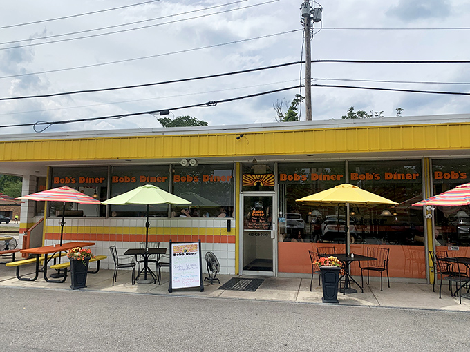 The sunshine-yellow awning of Bob's Diner beckons hungry travelers like a breakfast lighthouse on Carnegie's main drag.