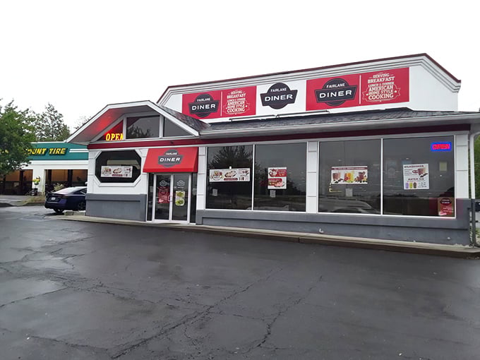 The unassuming exterior of Fairlane Diner stands like a humble superhero of breakfast, its powers hidden behind modest white walls and red trim.