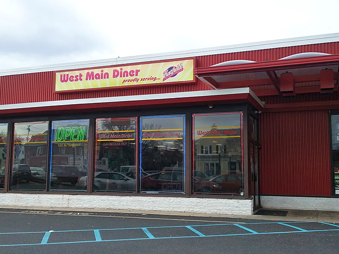 The red exterior of West Main Diner stands like a beacon of breakfast hope in Lansdale. That neon "OPEN" sign might as well say "Happiness Served Here."