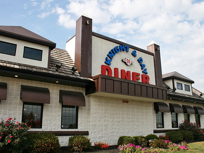 The classic stone facade and vibrant signage of Knight & Day Diner stands as a beacon for hungry travelers. Pennsylvania charm meets roadside comfort in architectural form.