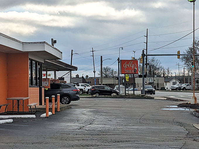The iconic orange exterior of Jolly's Drive-In stands as a beacon of hope for hungry travelers. This Hamilton landmark promises simple pleasures in a complicated world.