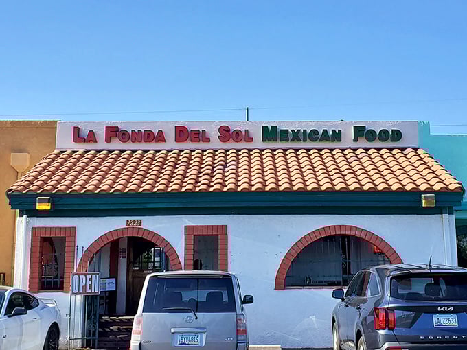 The unassuming exterior of La Fonda Del Sol beckons with its classic Spanish-style roof and distinctive red-trimmed arches&mdash;proof that culinary treasures often hide in plain sight.