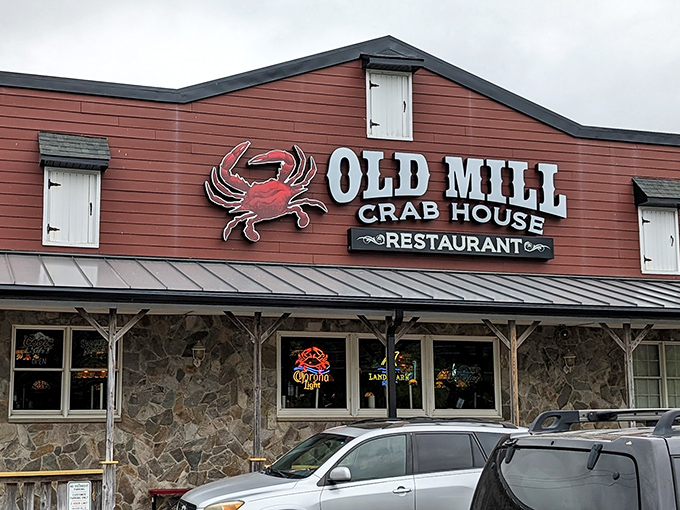 That iconic red exterior with stone foundation isn't trying to impress anyone, which is exactly why it does. Classic crab house charm at its finest.