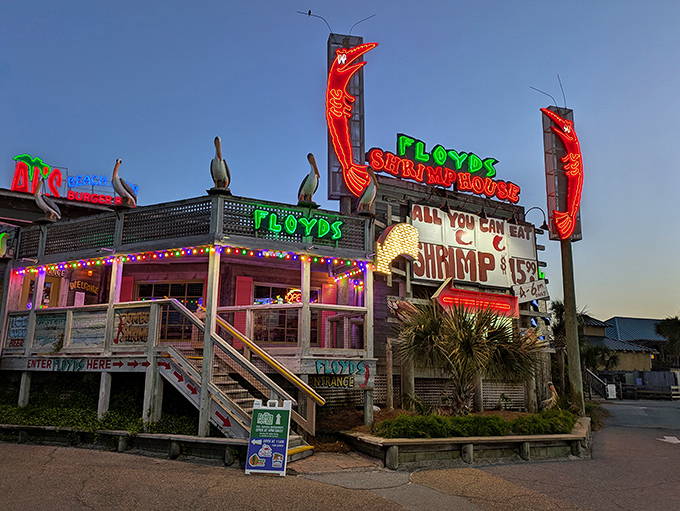 Floyd's neon-lit exterior glows like a beacon for seafood lovers, promising all-you-can-eat shrimp under the Florida sky.