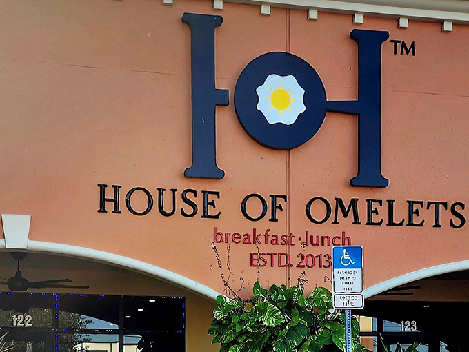 That coral-colored exterior promises serious breakfast business &ndash; and those tropical plants whisper "Florida magic awaits."