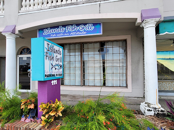 A splash of turquoise and purple announces this hidden gem, where the unassuming exterior belies the culinary treasures waiting inside.