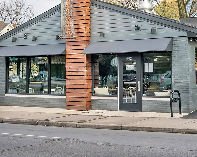 The bright orange awning of Tinker Street beckons like a culinary lighthouse on an unassuming Indianapolis corner. Prepare to be surprised.