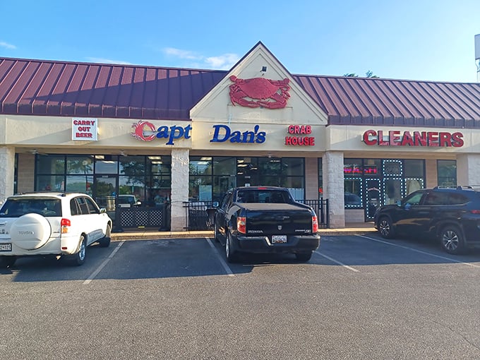 The red crab perched atop Captain Dan's storefront isn't just decoration—it's a beacon calling seafood lovers home to this Eldersburg treasure.