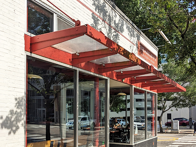 The iconic red awning of Beasley's stands out against white brick like a beacon calling all fried chicken enthusiasts home to roost.