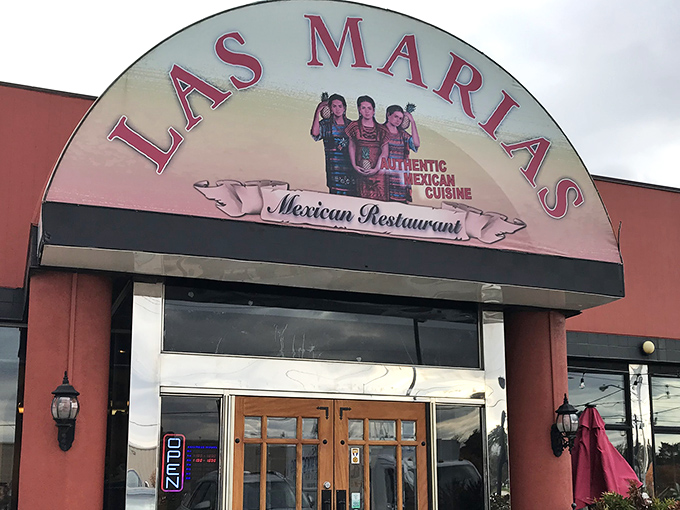 The iconic arched entrance of Las Marias welcomes hungry visitors with its vibrant signage and promise of authentic Mexican cuisine.