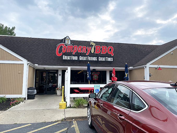 The promise of smoky delights awaits behind that red sign. Company 7 BBQ's unassuming exterior hides flavor explosions that would make your taste buds stand at attention.