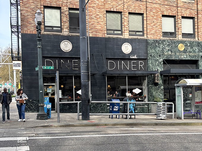 Classic "DINER" signage against dark green marble facade – Portland's culinary treasures often hide in plain sight, waiting for the hungry and curious.