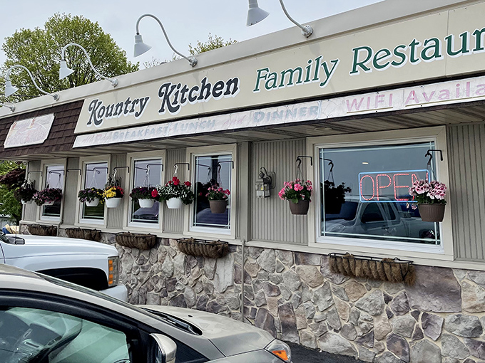 Classic Pennsylvania charm on display&mdash;stone foundation, cream siding, and those cheerful hanging baskets that say "come on in, we've got something good cooking."