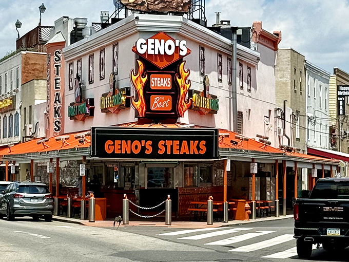 The neon-lit corner of 9th and Passyunk announces itself like Vegas had a baby with a sandwich shop. Geno's iconic orange glow beckons hungry pilgrims from blocks away.