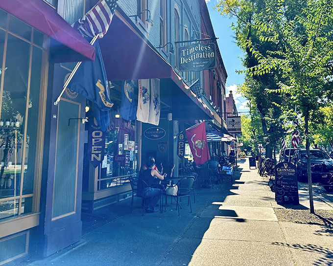 Wellsboro's Main Street charm on full display! Timeless Destination's inviting storefront beckons hungry travelers with its classic awning and outdoor seating perfect for people-watching.