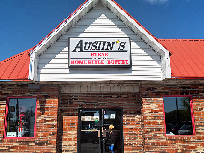 The iconic red-roofed Austin's beckons hungry travelers like a lighthouse of comfort food, promising Southern hospitality under that distinctive Knoxville sky.