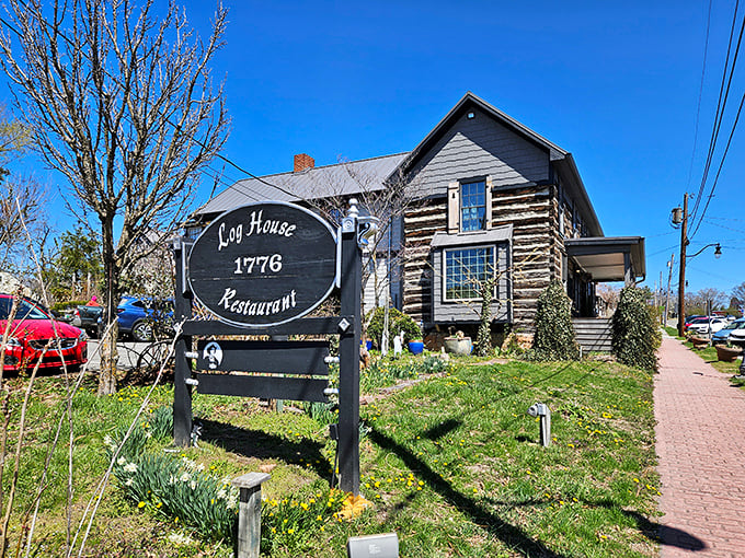 The historic Log House Restaurant stands proudly in Wytheville, its weathered timbers and twin brick chimneys whispering tales of Virginia's past.
