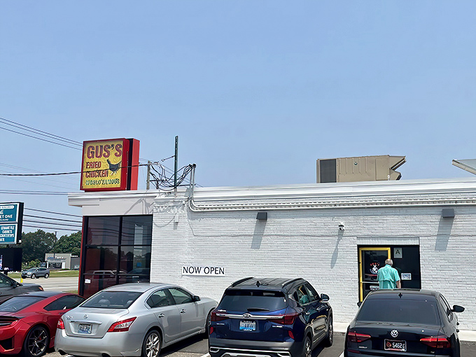 The unassuming white building with its bold red sign promises culinary greatness without the fanfare. Like all true legends, Gus's lets its chicken do the talking.