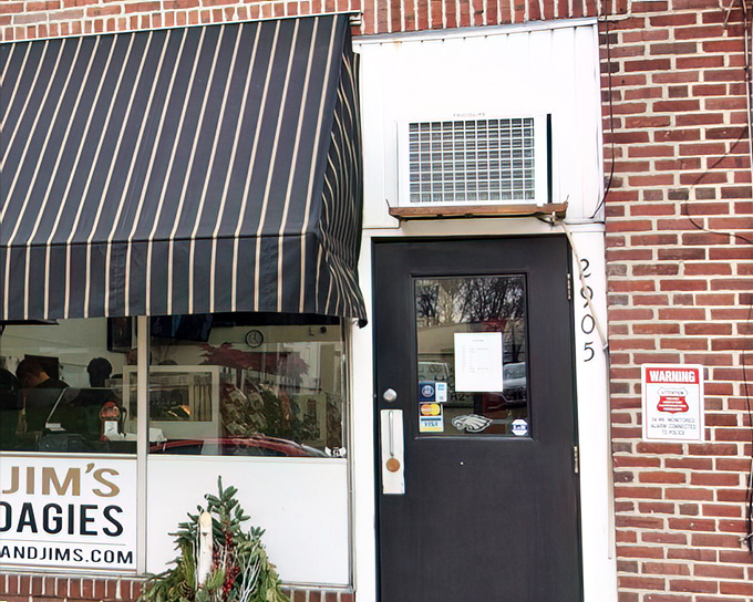 The unassuming storefront that houses sandwich greatness. Classic striped awning, brick facade, and zero pretension&mdash;just the way a legendary hoagie shop should be.