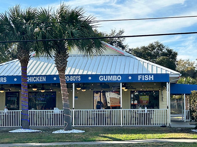 This cheerful yellow building might look humble, but it's hiding serious seafood secrets behind those blue awnings.