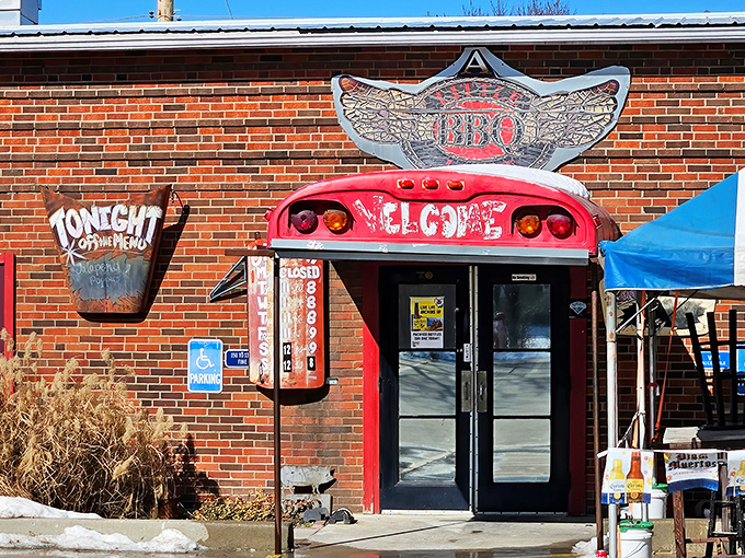 The winged BBQ logo above the entrance isn't just decoration&mdash;it's a promise that your taste buds are about to take flight at this unassuming brick building.