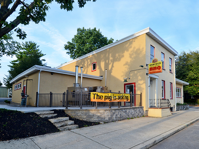 The bright yellow exterior of Harvey's Main Street BBQ isn't just eye-catching&mdash;it's a smoke signal to hungry travelers. That banner doesn't lie: the pig is indeed smoking!