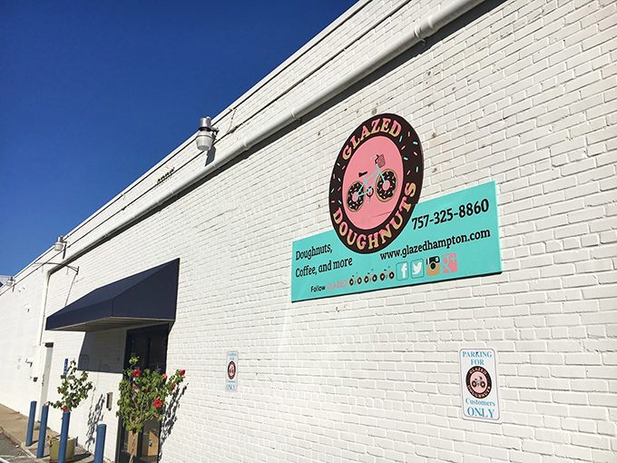 A simple sign against white brick announces what locals already know: this is doughnut headquarters. No fancy frills needed when the goods speak for themselves.