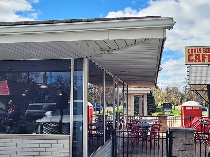 Outdoor seating with cheerful red tables offers a perfect perch for people-watching while savoring those legendary scrambled eggs.
