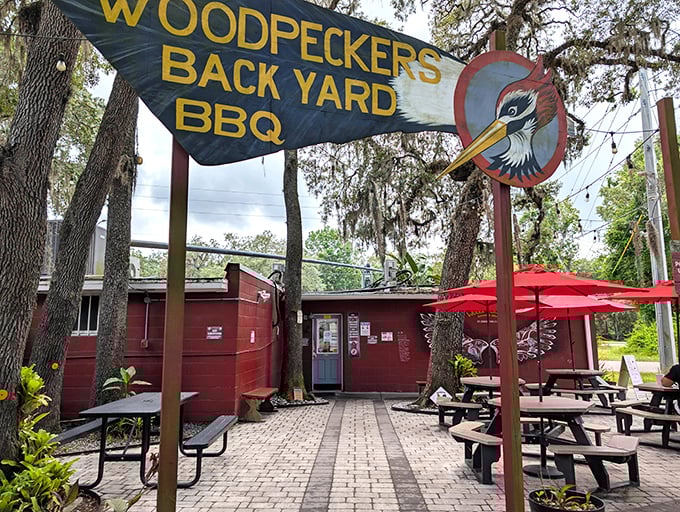 The entrance to barbecue paradise isn't always pearly gates &ndash; sometimes it's a rustic red building with a woodpecker sign promising smoky delights.
