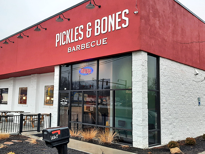 The bold red exterior of Pickles & Bones Barbecue isn't just a color choice&mdash;it's a warning sign that something seriously delicious is happening inside.