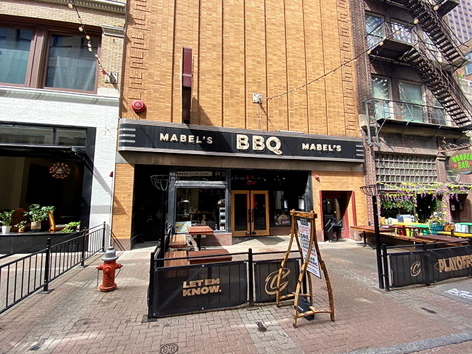 The brick facade of Mabel's BBQ stands like a meaty beacon in downtown Cleveland, promising smoky salvation to all who enter.