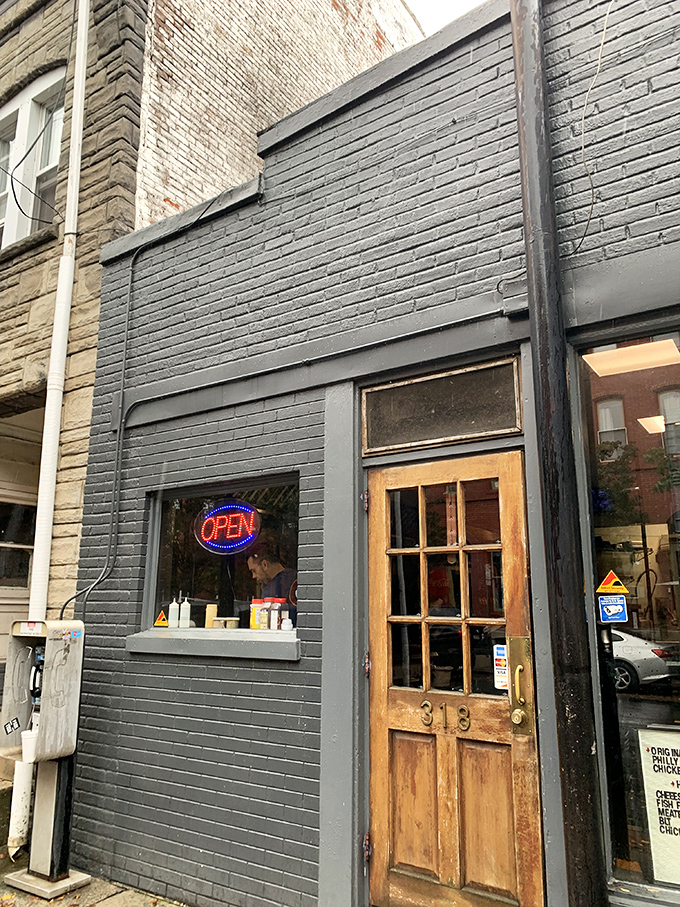 That wooden door with the number 318 isn't just an entrance &ndash; it's a portal to cheesesteak nirvana that locals have been keeping to themselves.