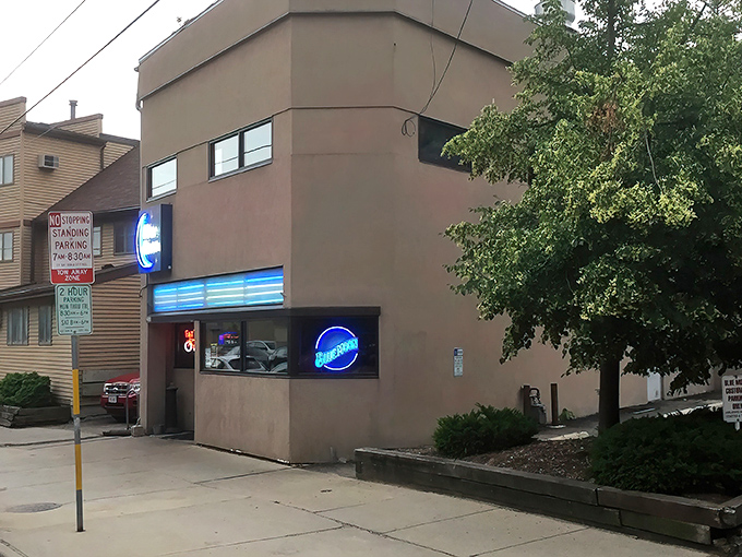 The unassuming exterior of Blue Moon Bar & Grill stands like a culinary speakeasy, its blue neon sign a beacon for those in-the-know seeking Wisconsin's finest cheese curds.