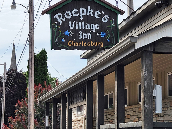 The iconic sign beckons hungry travelers like a lighthouse for the famished. Roepke's Village Inn promises comfort food salvation in Charlesburg's countryside.