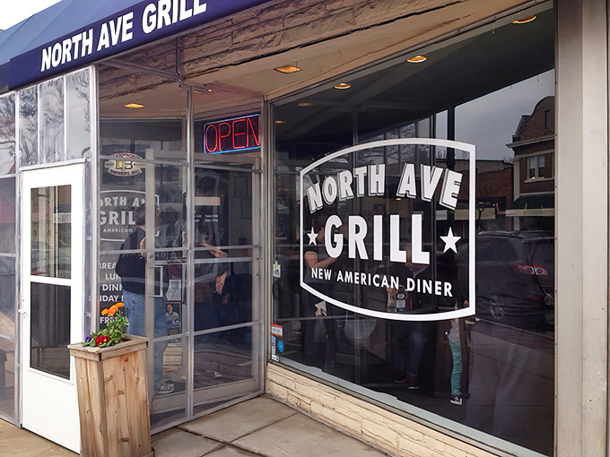 The unassuming storefront of North Ave Grill beckons with honest simplicity. That neon "OPEN" sign might as well say "Come get happy."