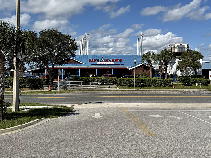 The iconic blue roof of Safe Harbor beckons seafood lovers like a maritime lighthouse, promising treasures from the deep just steps away from Atlantic Beach.