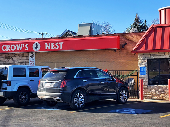 Bathed in sunshine, the stone exterior and signature red signage of The Crow's Nest stands as a beacon for hungry travelers. Like finding a treasure map where X marks the spot.