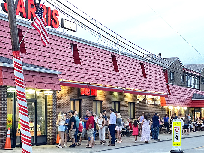 The iconic red-shingled roof of Sarris Candies beckons like a lighthouse for sweet-toothed travelers, with a cheerful storefront that invites visitors inside for a world of chocolate delights.